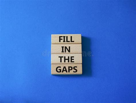 Fill In The Gaps Symbol Concept Words Fill In The Gaps On Wooden Blocks Beautiful Blue