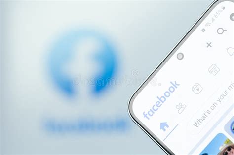 open facebook app on smartphone editorial photography image of focus