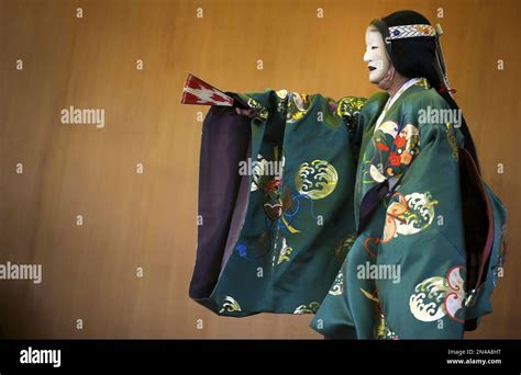 An Artist Performs A Traditional Kagura Or A Scared Dance Dedicated To
