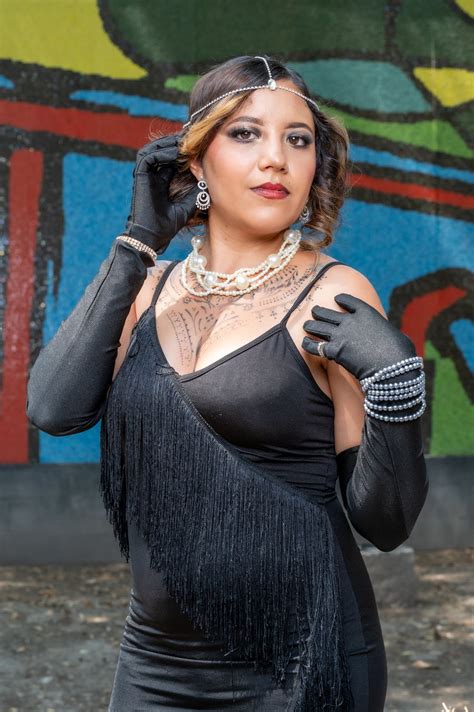 Photo Of A Woman Wearing A Black Dress Gloves And Jewelry · Free Stock