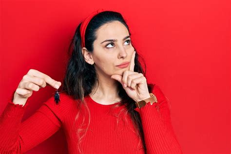 Premium Photo Young Hispanic Woman Holding Cockroach Serious Face