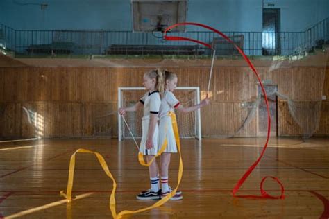 Twins Doing Rhythmic Gymnastics Photos By Canva