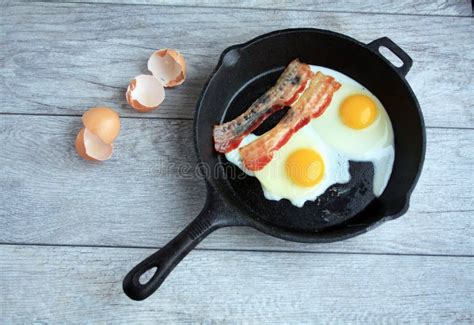 Bacon And Eggs In Cast Iron Skillet Stock Image Image Of Brown
