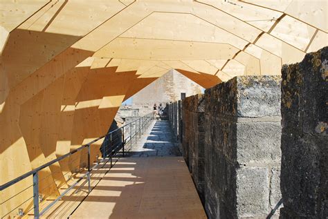 Nas Architecture Installs Wooden Vortex Over Medieval Wall