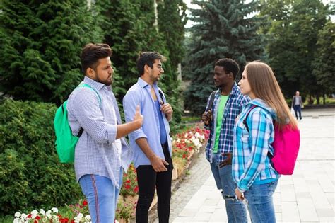 Premium Photo Group Of Studens Stand With Backpacks At The Campus And