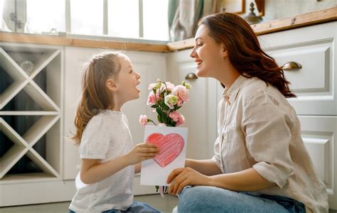 Premium Photo Daughter Giving Mother Bouquet Of Flowers