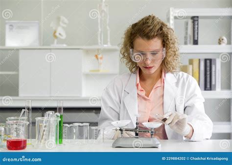 Scientist Measuring Acidity And Ph Of Soil At Table Laboratory