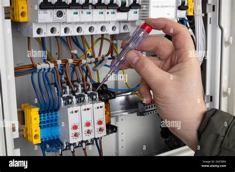 Technician Using Voltage Tester On Wiring Stock Photo Alamy