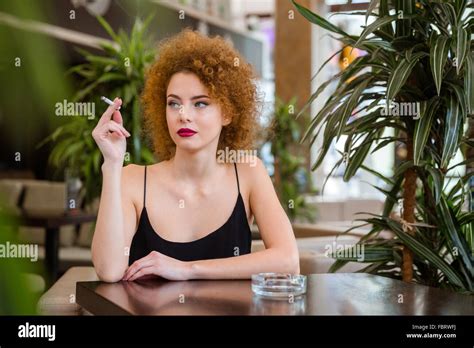 Beautiful Redhead Woman Smoking Cigarette Hi Res Stock Photography And Images Alamy