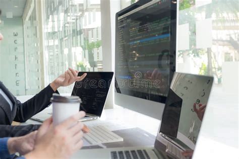 Programmers Work On The Development Of Coding And Coding Technology On White Desks And Website