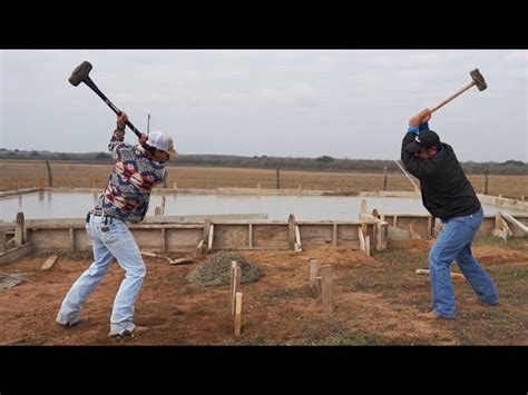 Swinging Sledgehammer A Man Swings A Sledgehammer At A Interior Wall