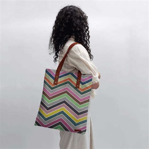 dailyobjects journey dark tote bag in colorful zigzag line pattern
