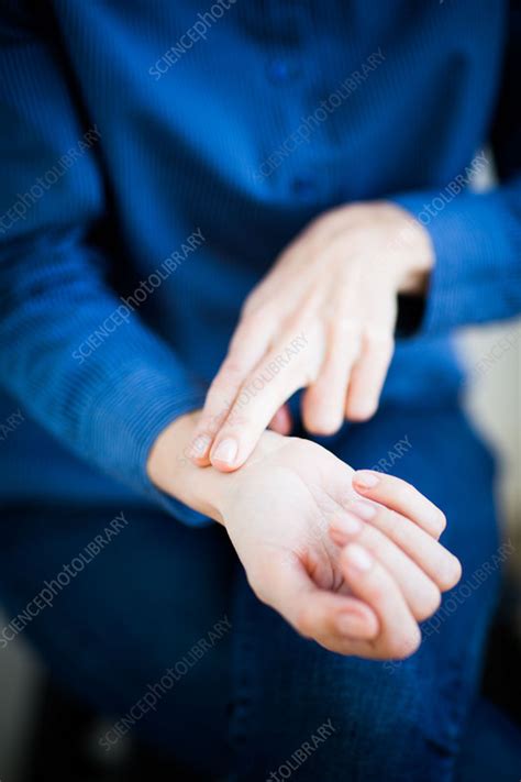 Woman Checking Pulse Stock Image C035 2086 Science Photo Library