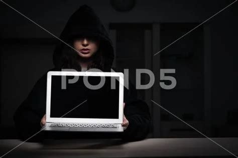 Female Hacker Hacking Security Firewall Late In Office Hi Res 123232668