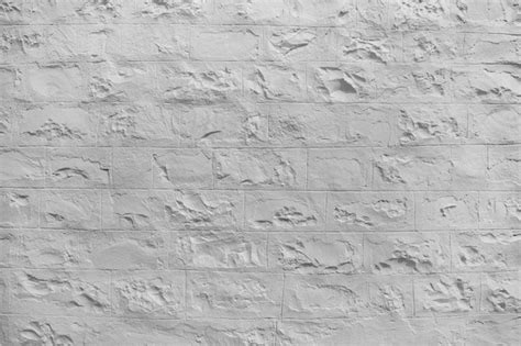 Premium Photo White Painted Rough Stone Wall Texture