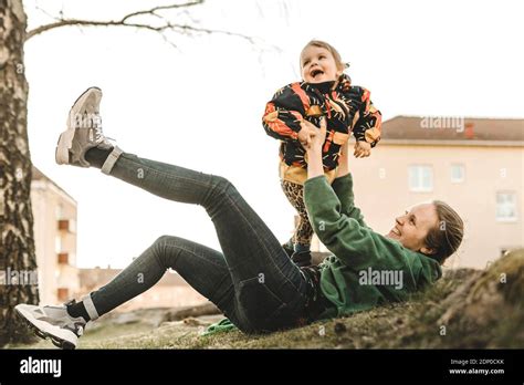 Mother Daughter Lying Playing On Hi Res Stock Photography And Images Alamy