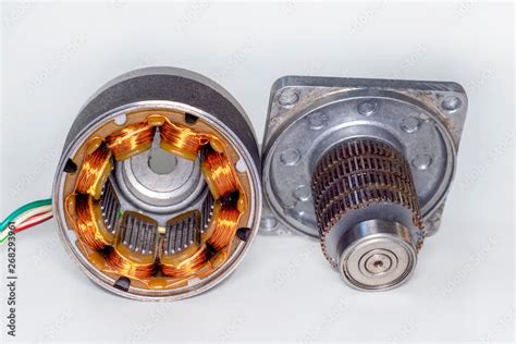 Stepper Motor Disassembled With The Rotor Set Aside Stepper Motor With Power Cable Attached
