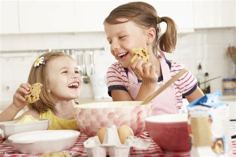 Two Girls Baking In Kitchen Stock Image Image Of Kitchen Cooking