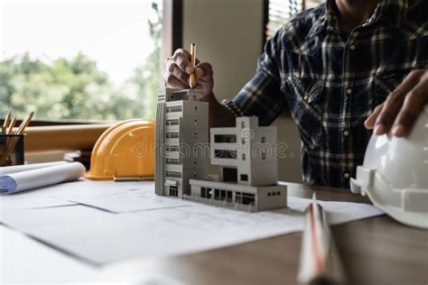 Architect Man Working With Blueprints For Architectural Plan Engineer Sketching A Construction