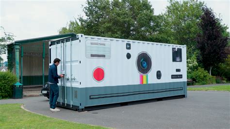 shipping container transformed into a giant camera and darkroom urbanist