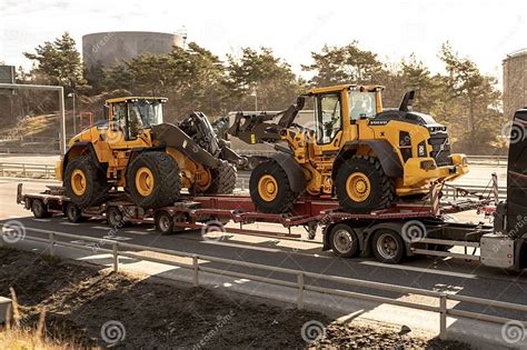 Volvo Wheel Loaders Being Transported On A Trailer Editorial Photo