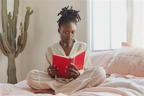 Premium Photo A Laptop Is On Top Of A Stack Of Books
