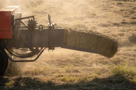 Premium Photo Agricultural Industry Grass Harvesting Machinery Or