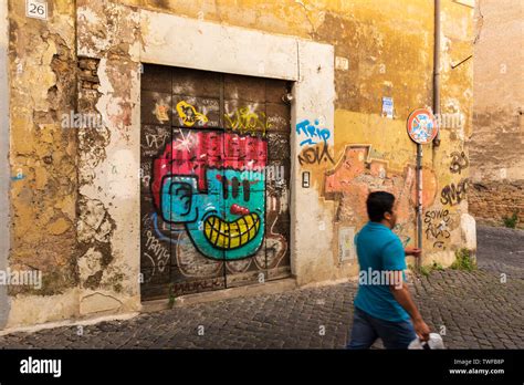 Colourful Street Art Adorns The Backstreet Walls Of Trastevere Stock