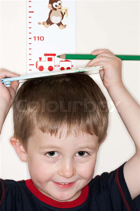 Boy Measuring His Height Stock Image Colourbox