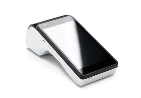 Premium Photo Pos Terminal Device For Reading Banking Cards Isolated On White Wall