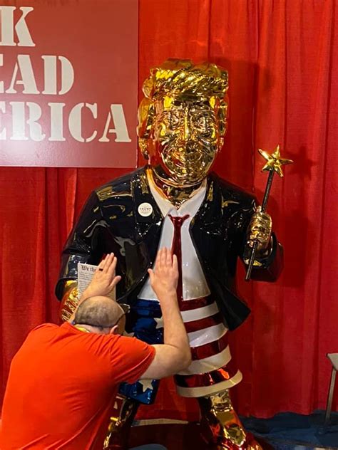 Photos Golden Trump Statue At Cpac Draws Fans Criticism