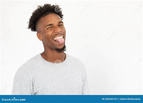 Portrait Of Joyful African American Man Sticking Out Tongue Stock Image