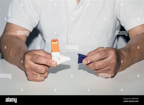 Man Holding Asthma Inhaler In His Hands Asthma Medications Inhalers On A White Background Lung