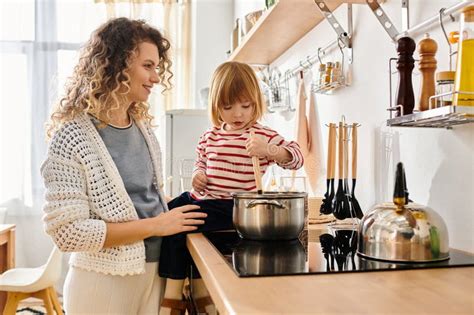 A Curly Haired Mom And Daughter Stock Image Image Of Activities Culinary 355522417