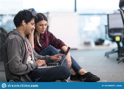 Software Developers Couple Working On The Floor Stock Image Image Of