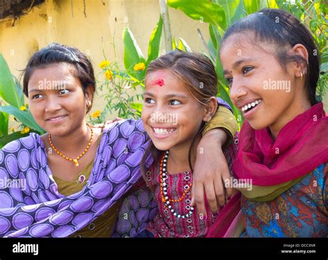 Three Happy Young Nepalese Girls Smiling In A Rural Terai Village