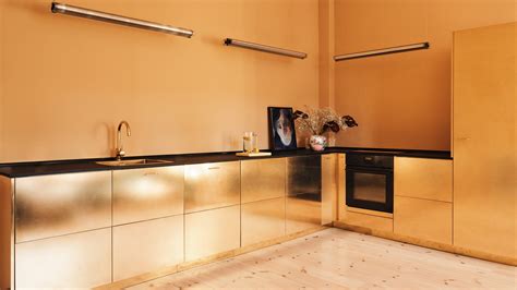 Reform Hacks Ikea Cabinets To Create Gold Hued Kitchen For Stine Goya
