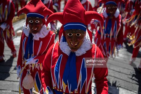 People With Jokili Costumes Take Part In A Parade During Carnival