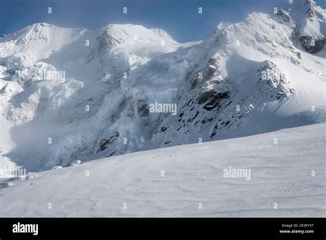 An Avalanche Tumbles Off Of A Calving Glacier High In The Southern Alps