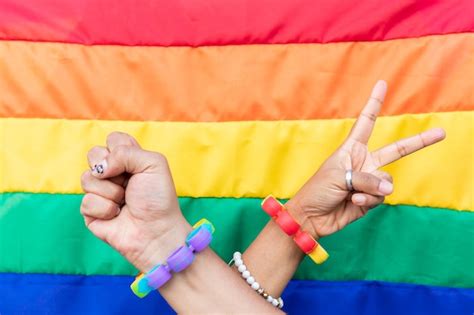 Premium Photo Hands Of Two People Wearing Lgbtq Pride Bracelets