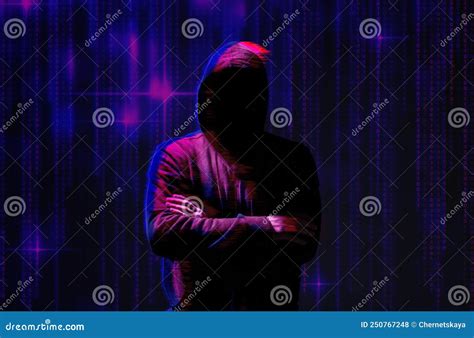 Silhouette Of Anonymous Hacker And Digital Binary Code On Dark