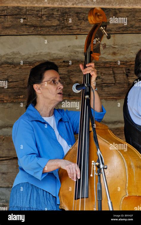 Woman Playing Bass On The Porch Of The Music Cabin At Sugarbush Farm