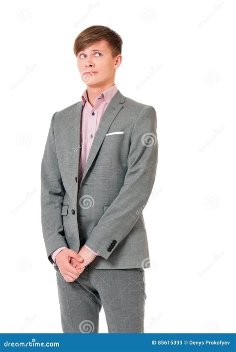 Shy Embarrassed Young Man Standing With Hands In Pockets Stock Image