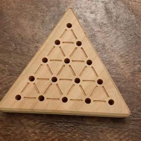 Triangle Peg Solitaire Classic Puzzle Game With A Modern Touch