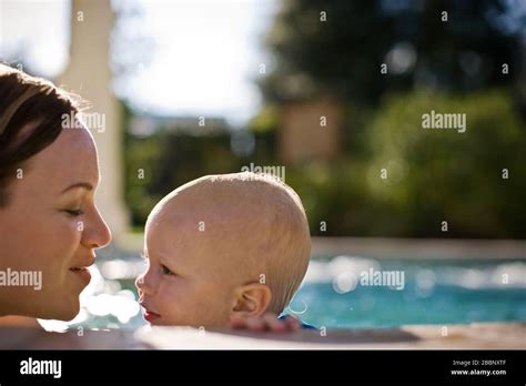 Mother Teaching Her Son To Swim Stock Photo Alamy