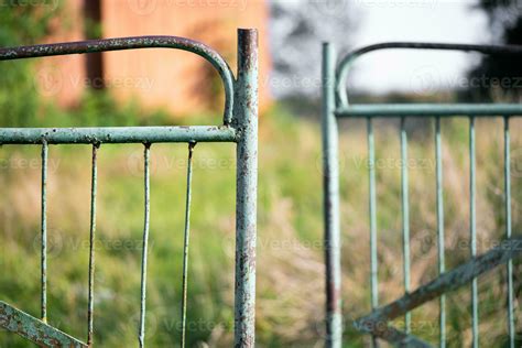 Old Rusty Metal Gate With Cracked Paint Stock Photo At Vecteezy