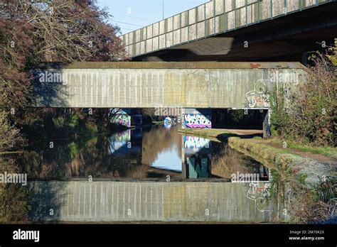 Brutalist Industrial Structures Passing Over The River Wey Navigation