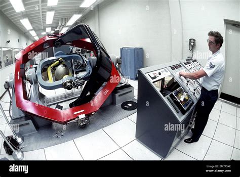 A Technician Using A Control Console Conducts A Bench Test Of A