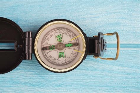 Close Up Of Navigational Compass On Table Premium Photo