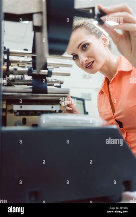 Worker Woman Putting New Labels In Printing Machine Stock Photo Alamy